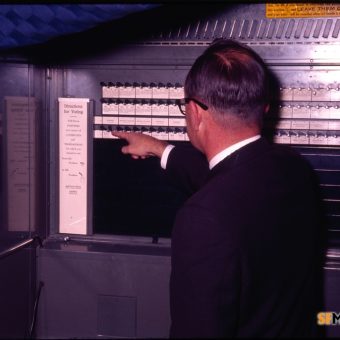Unknown Location Oct 1966 Man demonstrating a voting machine set up for ...